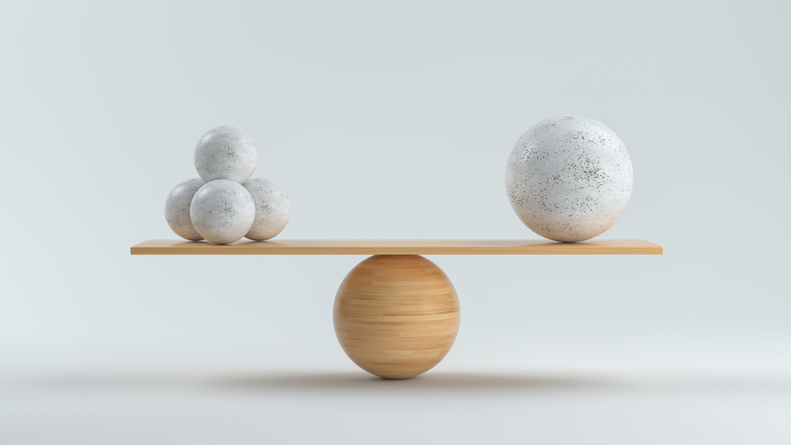 wooden scale balancing one big ball and four small ones - TOPkit